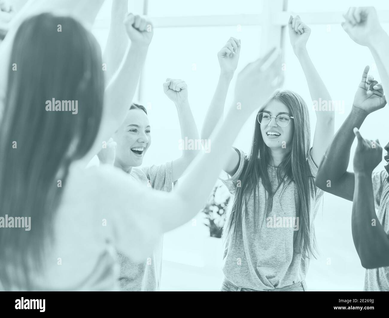 close up. a team of happy young people showing their unity Stock Photo ...