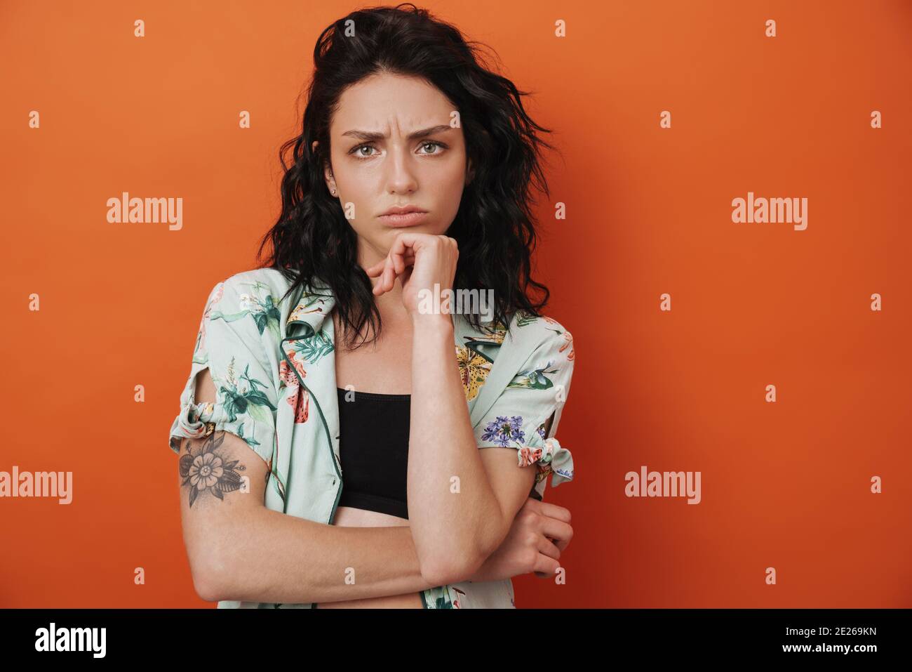 Picture of young sad woman isolated over orange wall background Stock ... Picture of young sad woman isolated over orange wall background Stock ...