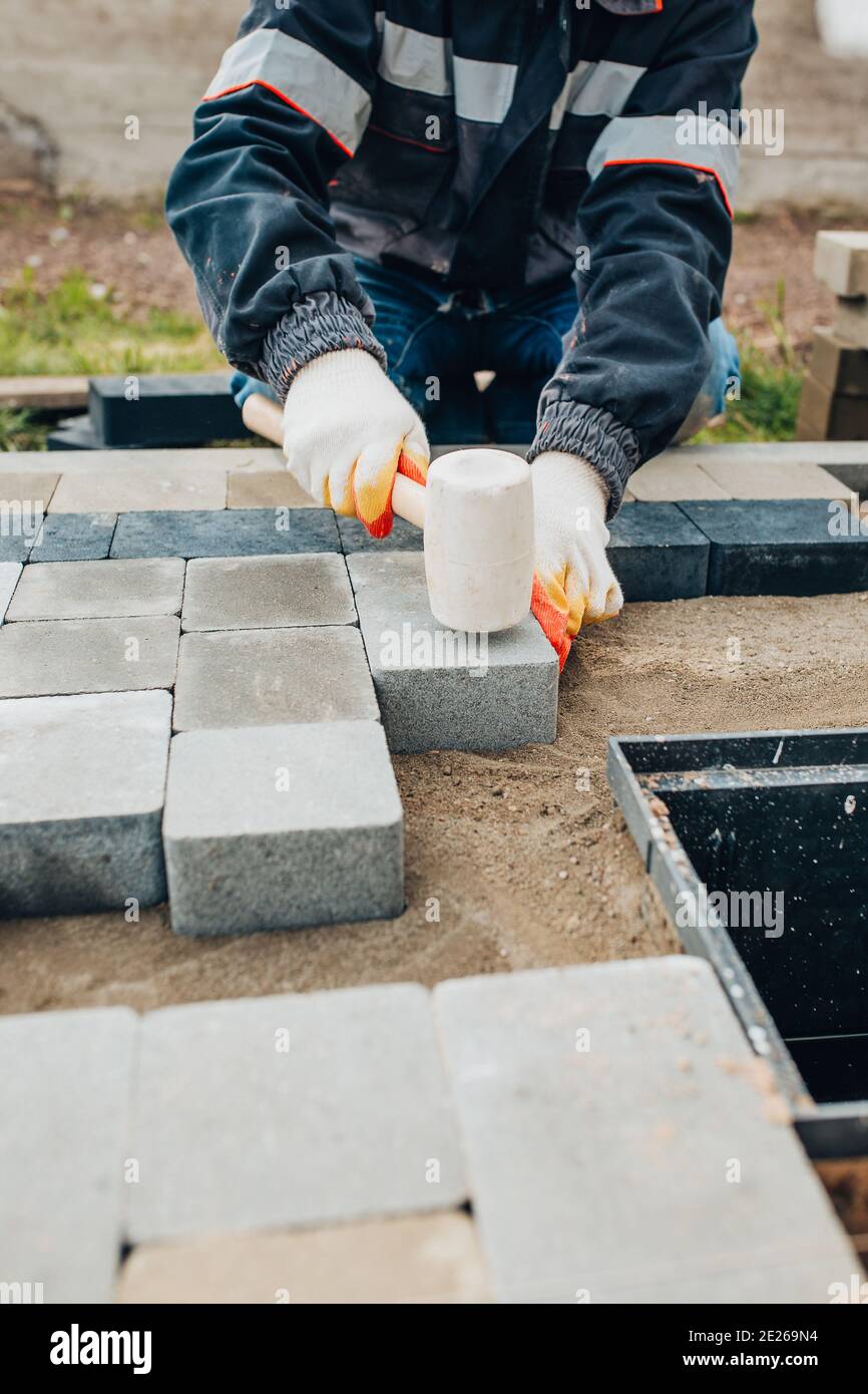 Professional laying of road stone and paving slabs for walking and ...