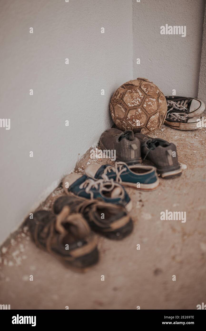 Old vintage worn out sports equipment for playing soccer - childhood is ...