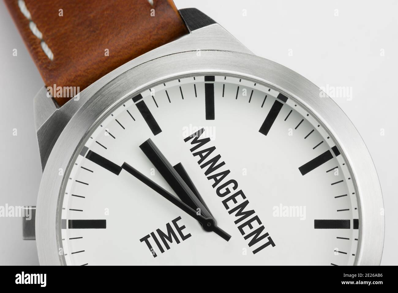 Macro photo of a modern metal watch with Time Management text on the ...