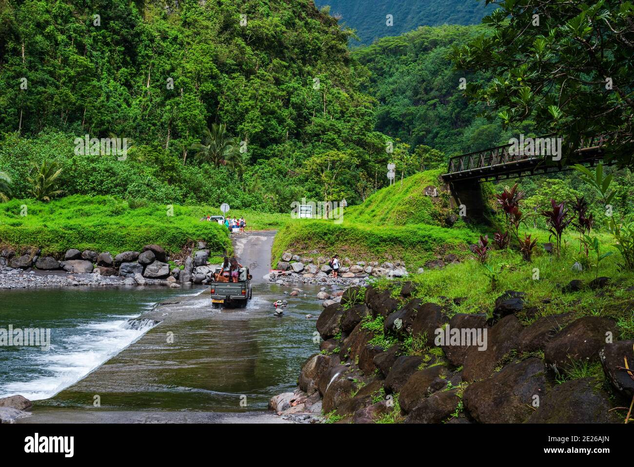 Tahiti, French Polynesia--March 18, 2018. Flatbed truck with passengers ...