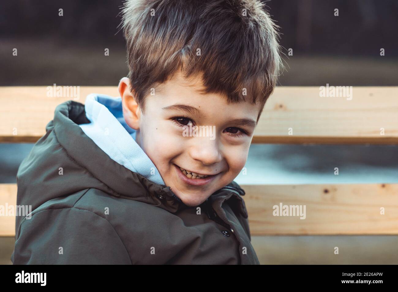 Portrait of a cute, little boy smiling timidly Stock Photo - Alamy