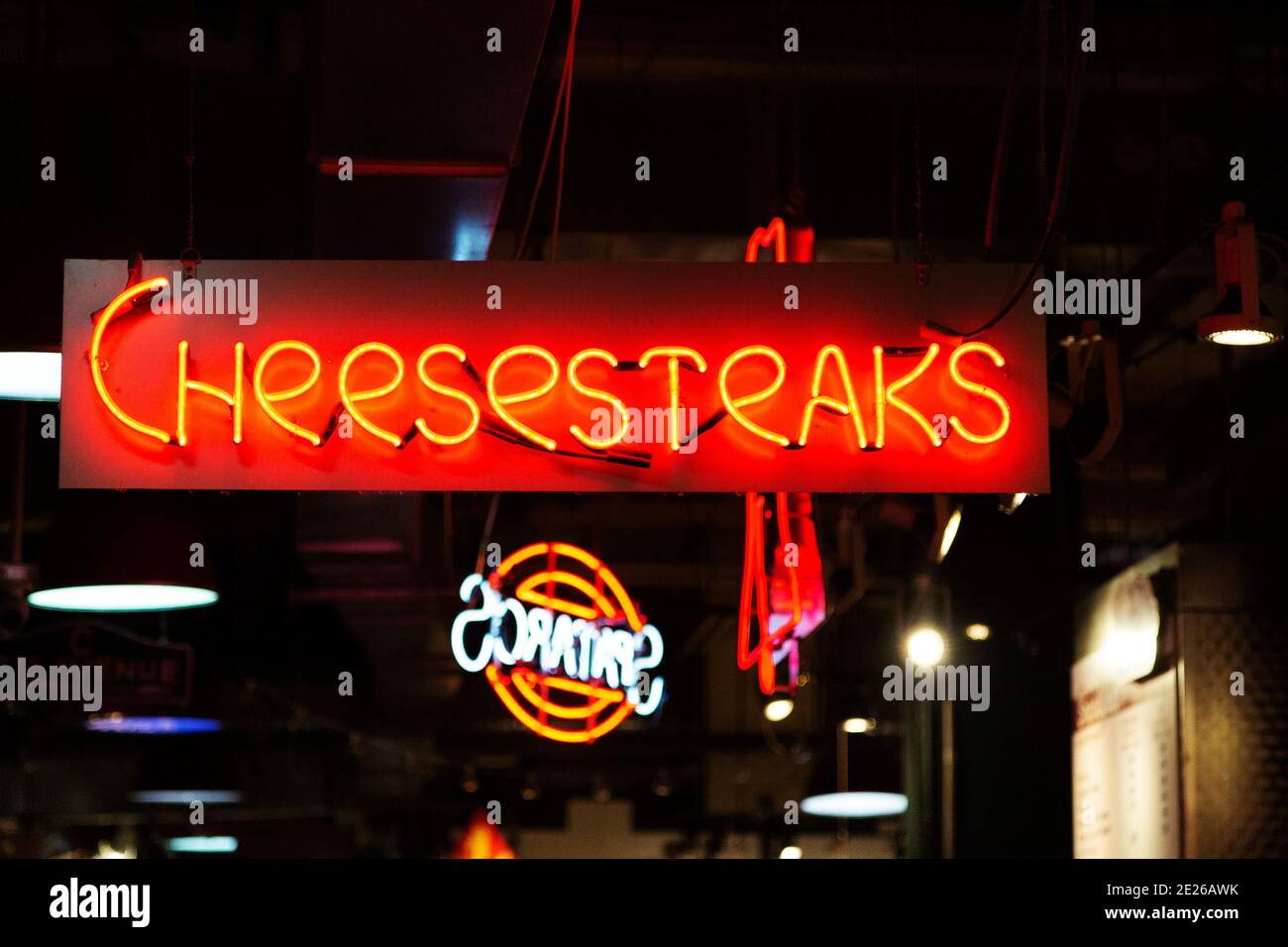 Neon light advertising cheesesteaks in Philadelphia, USA. The city is ...