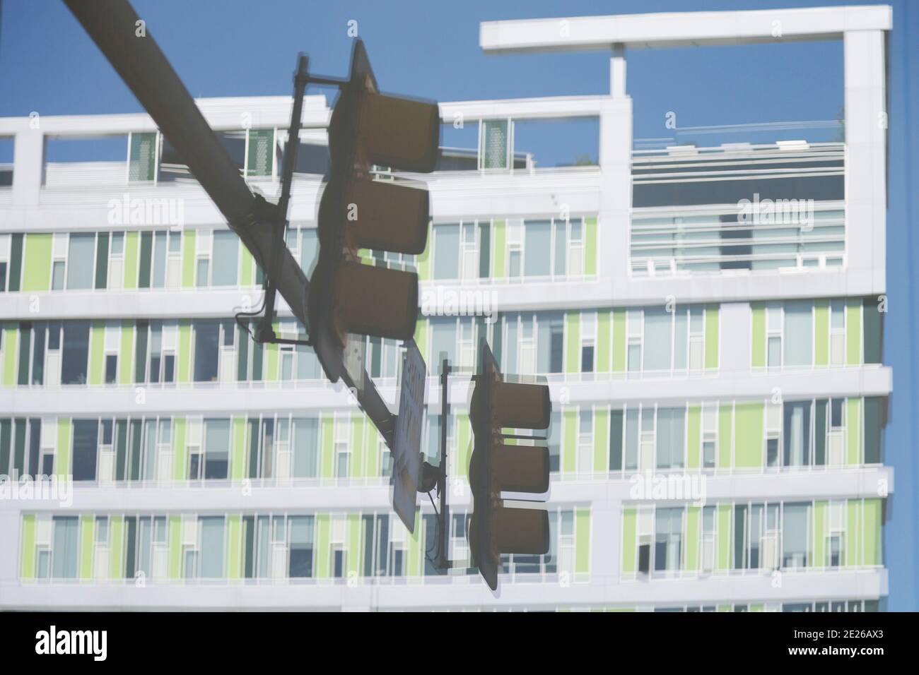 Traffic lights reflecting in a window in Philadelphia, USA. The facade ...