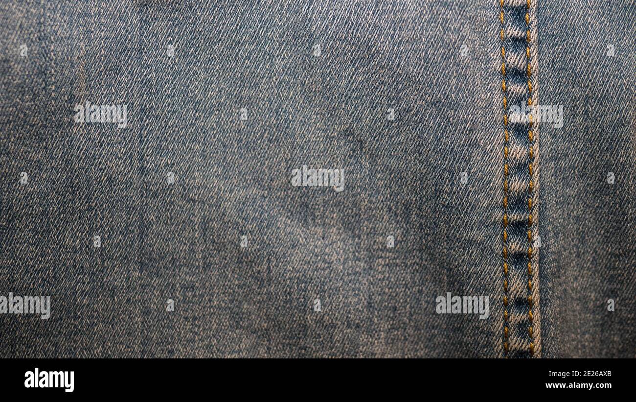 Denim fabric, denim texture. Stitched jeans Stock Photo - Alamy