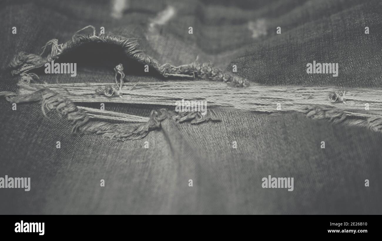 Denim texture, ripped jeans, stylish denim wallpaper Stock Photo - Alamy