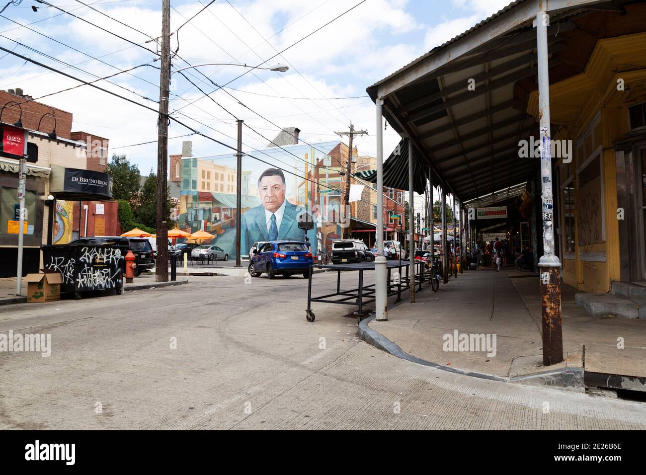 Covered sidewalk on a street in south Philadelphia, USA. A mural of ...