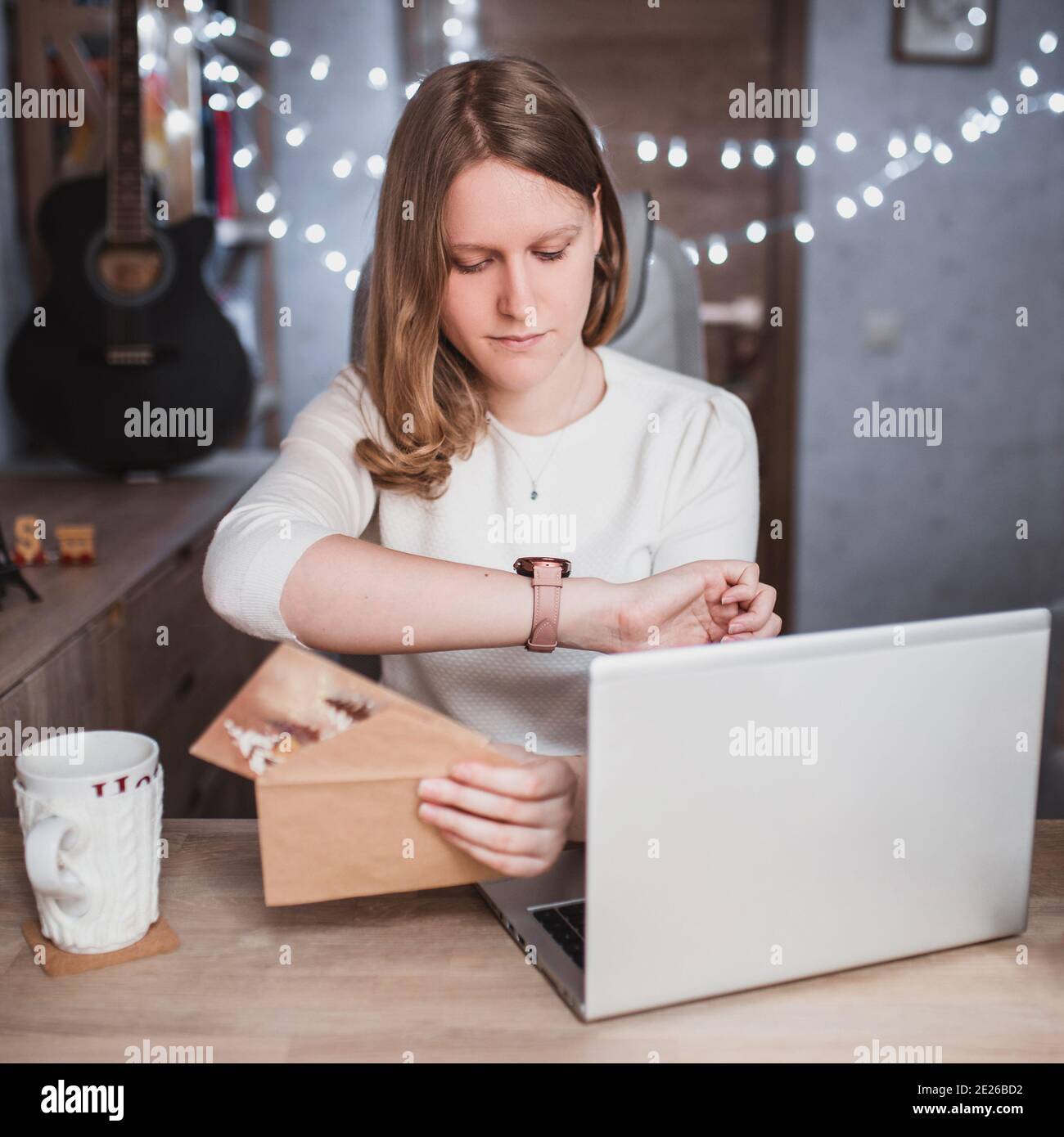 Blonde caucasian girl is in a hurry to write and send all ...