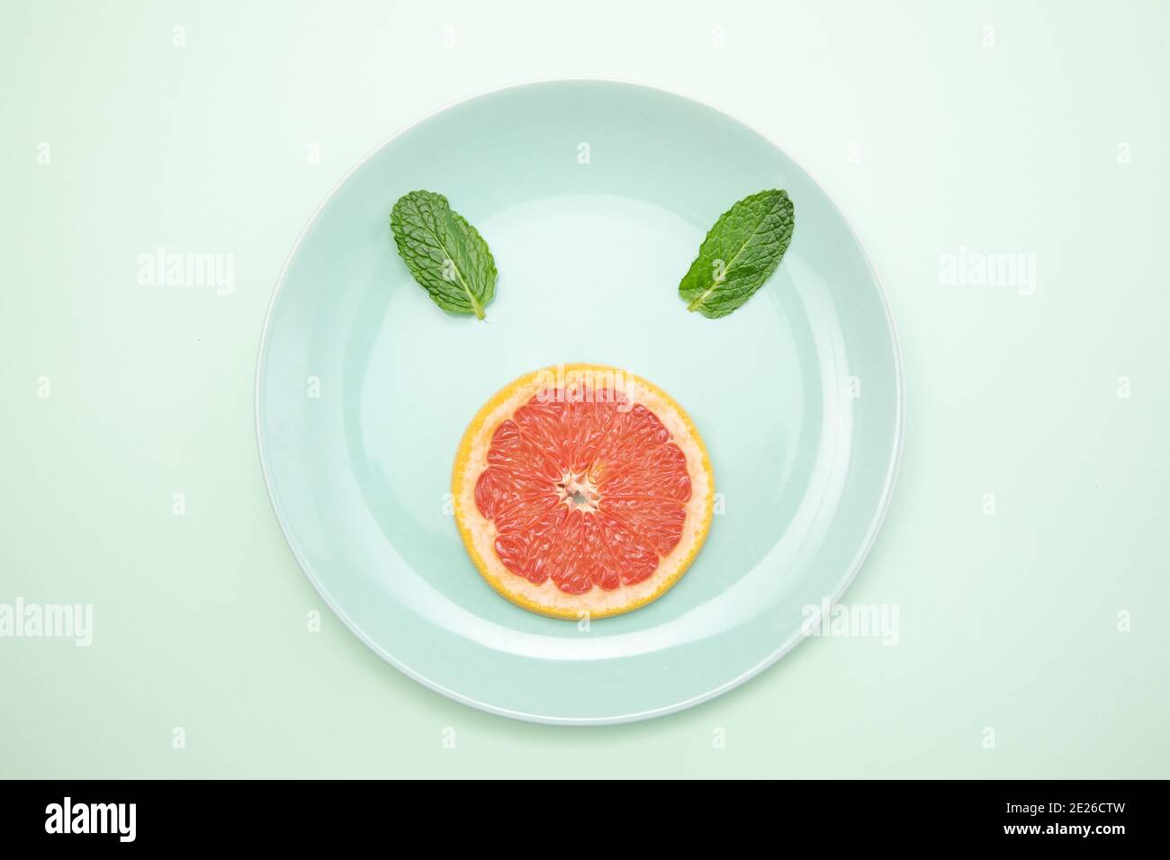 Top view of sliced grapefruit on a plate Stock Photo - Alamy