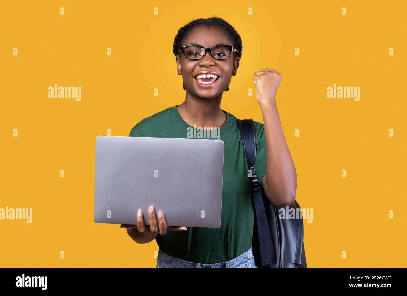 Joyful Female Student With Laptop Gesturing Yes On Yellow Background ...