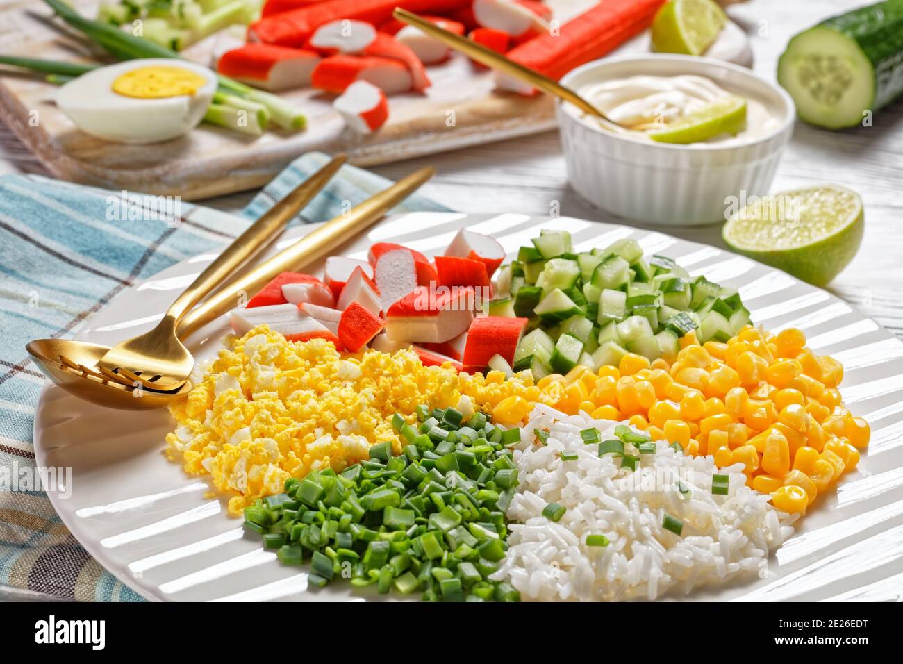 Crab salad of surimi sticks with canned corn, cucumbers, spring onion ...