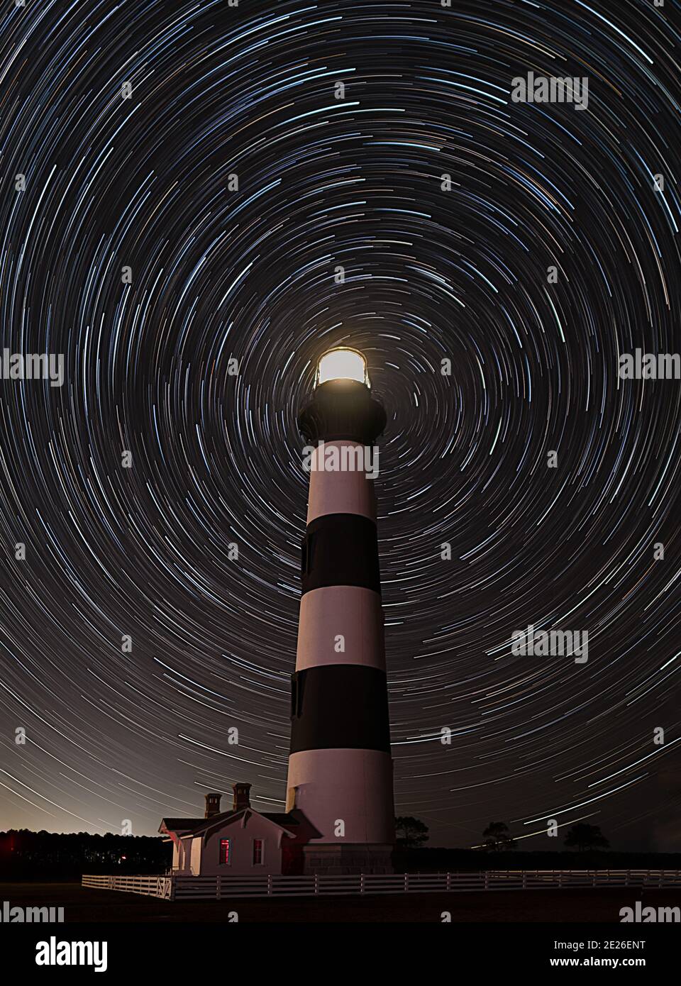 Star streaks across the night sky behind the Bodie Island Lighthouse ...