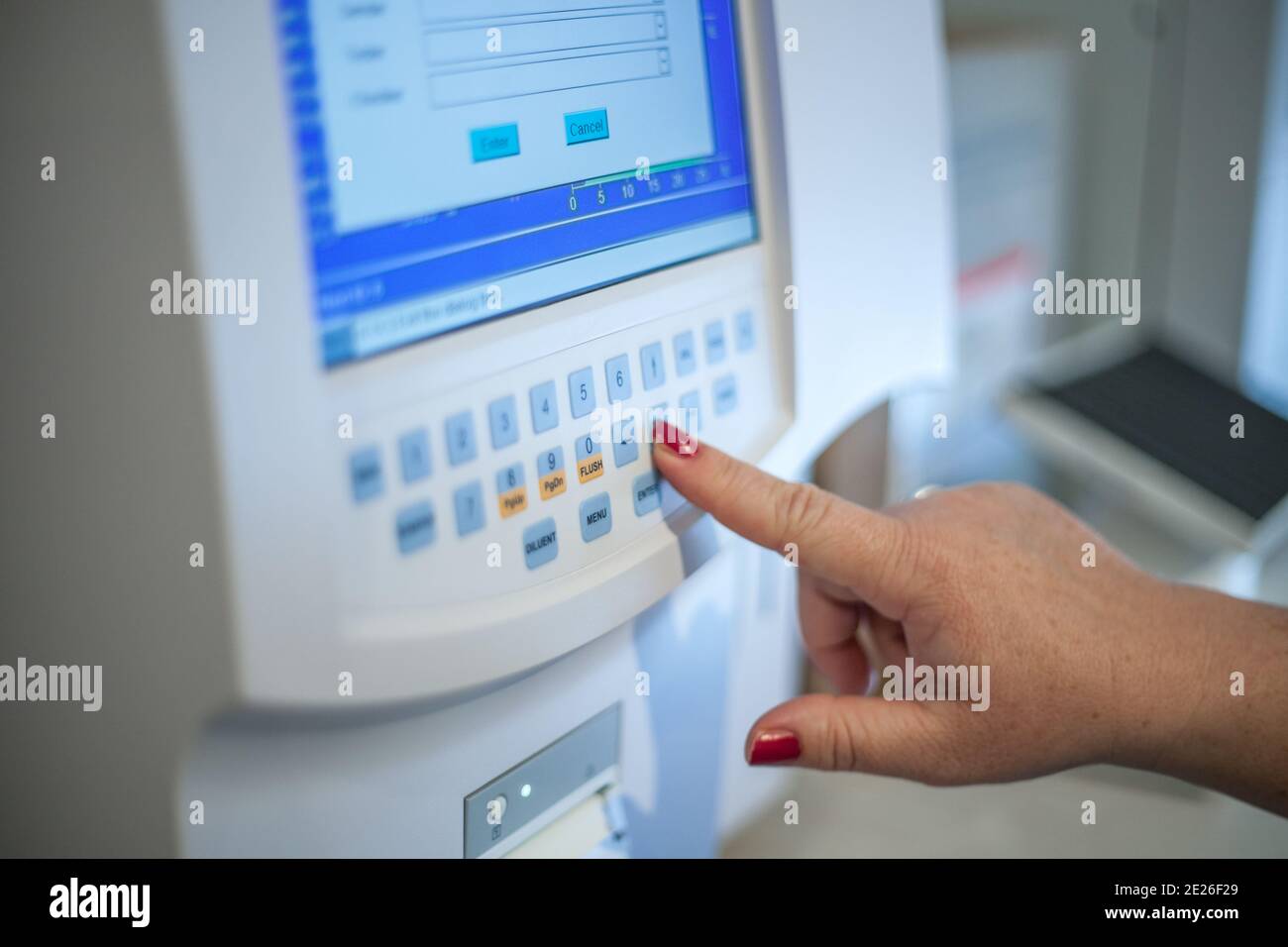 Selective focus shot of a female doctor adjusting the CBC (complete ...