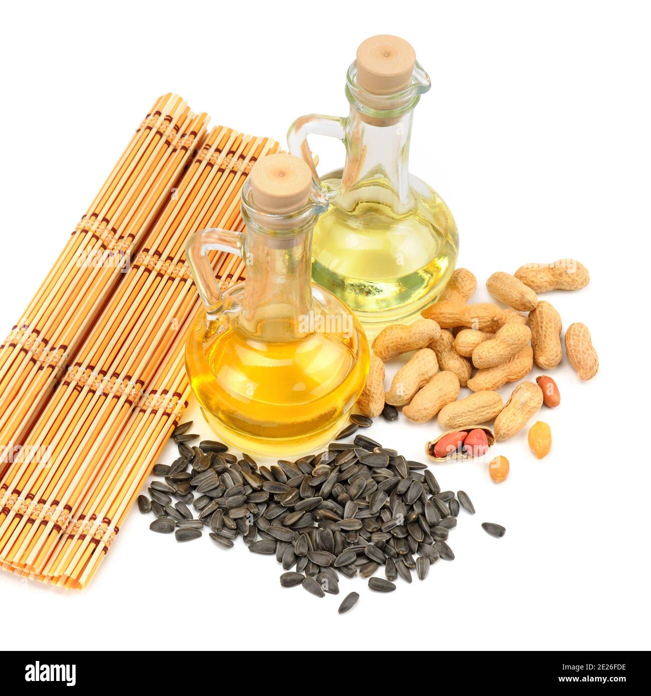 Peanuts, sunflower seeds and vegetable oils isolated on white ...