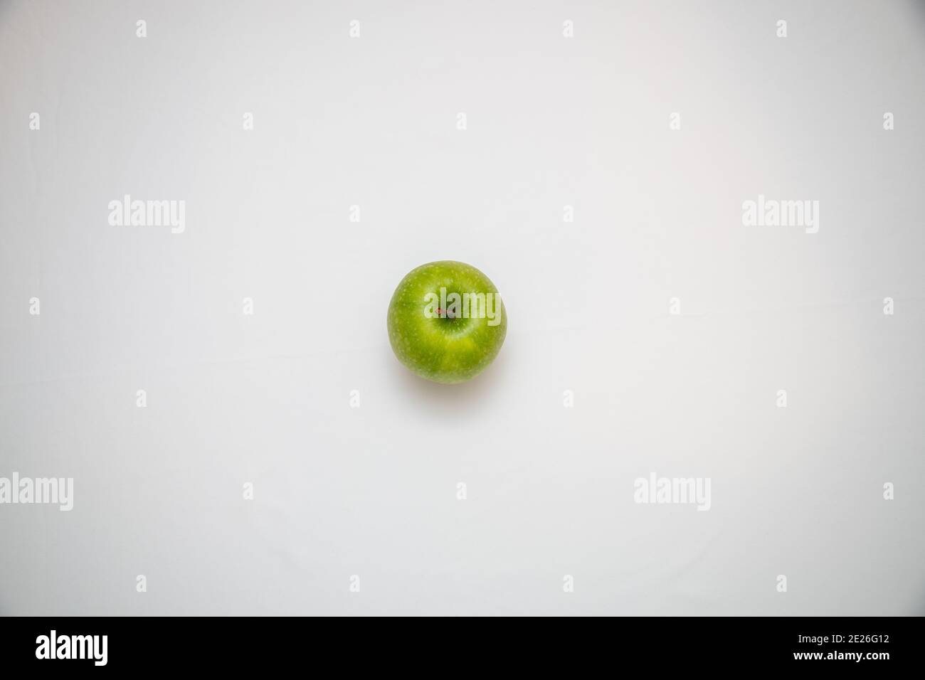 Top view of a single green apple on a white background Stock Photo - Alamy