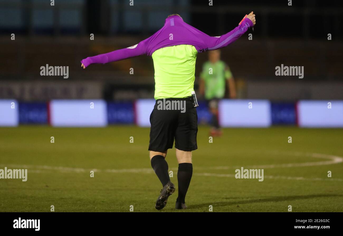 Referee John Busby changes his top to a purple one as his original ...