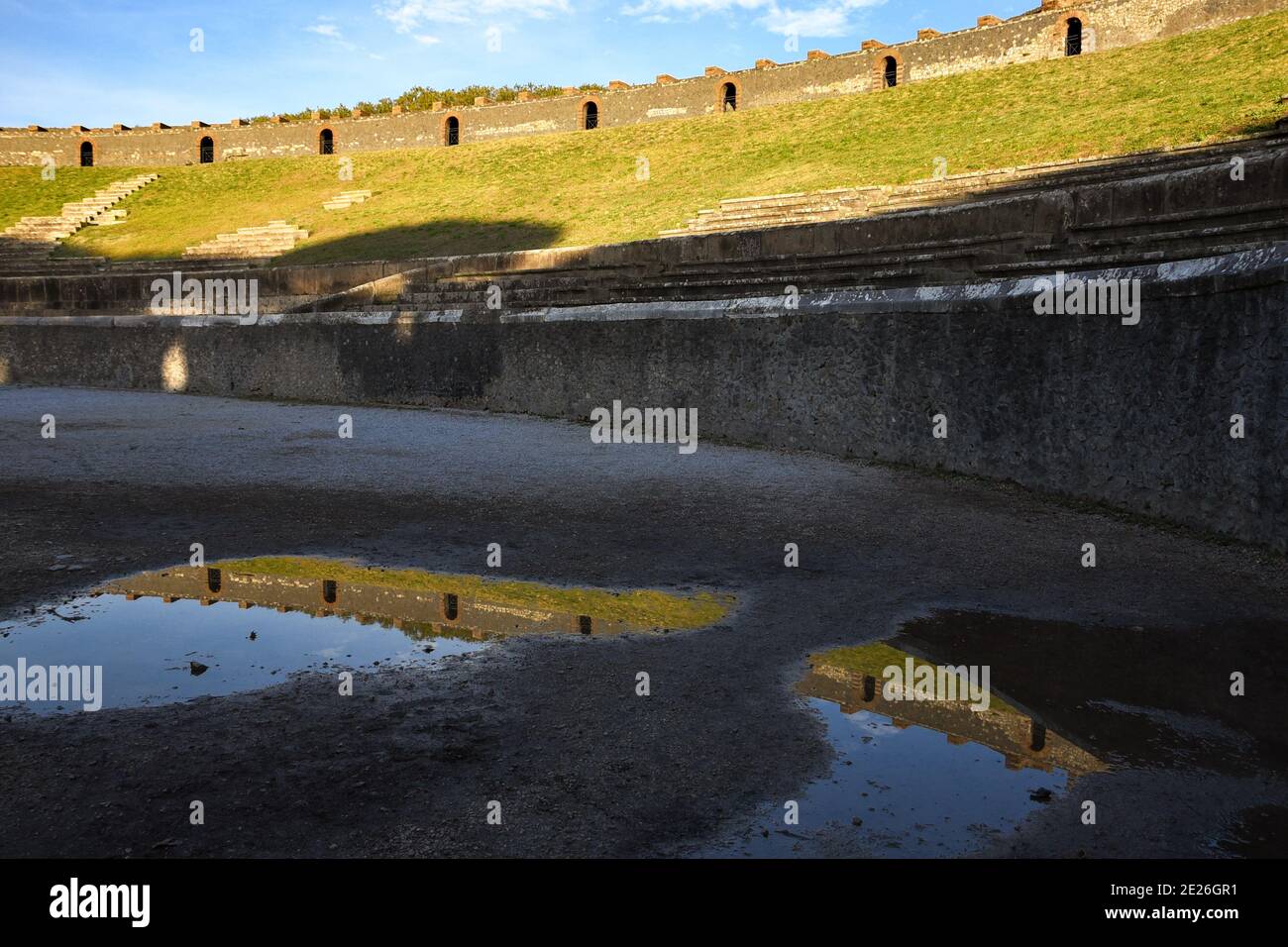 Amphitheatre of Pompeii after rain. Beautiful reflection in water ...