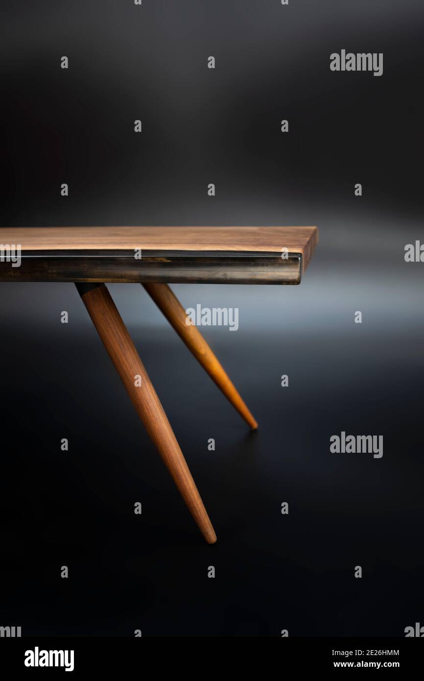 Modern handmade table made from a walnut tree Stock Photo - Alamy
