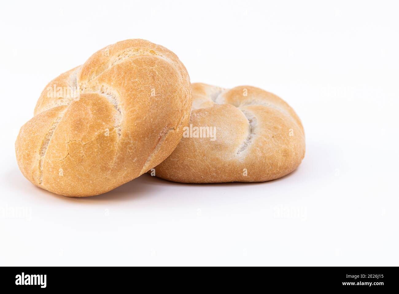 Closeup of freshly baked white bread buns isolated on a white ...