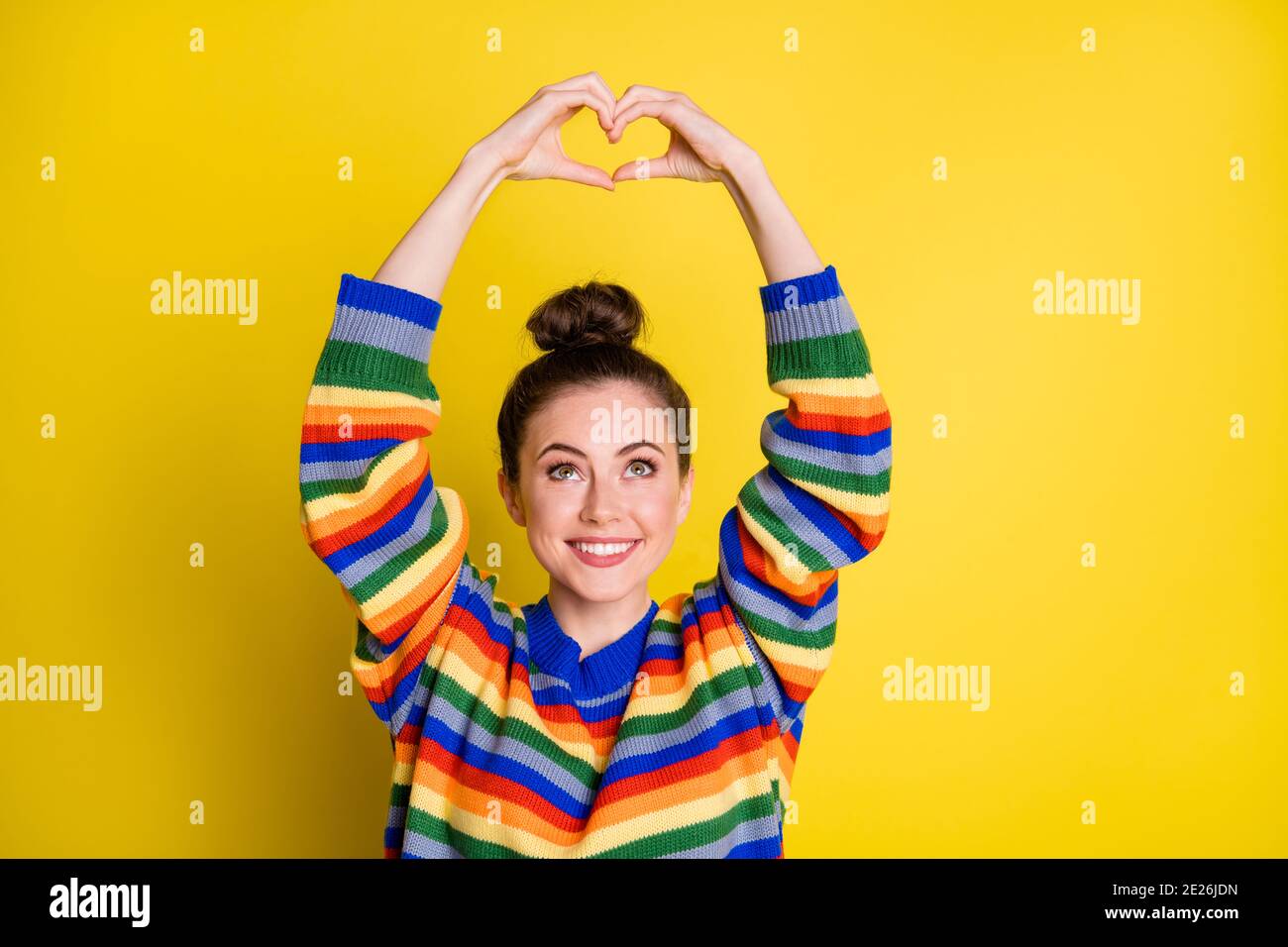 Photo of adorable young lady make hands look heart shape above head ...
