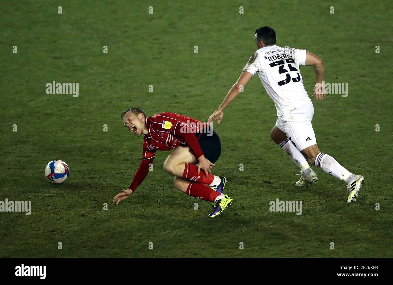 Lincoln City's Anthony Scully (left) and Accrington Stanley's Gary ...