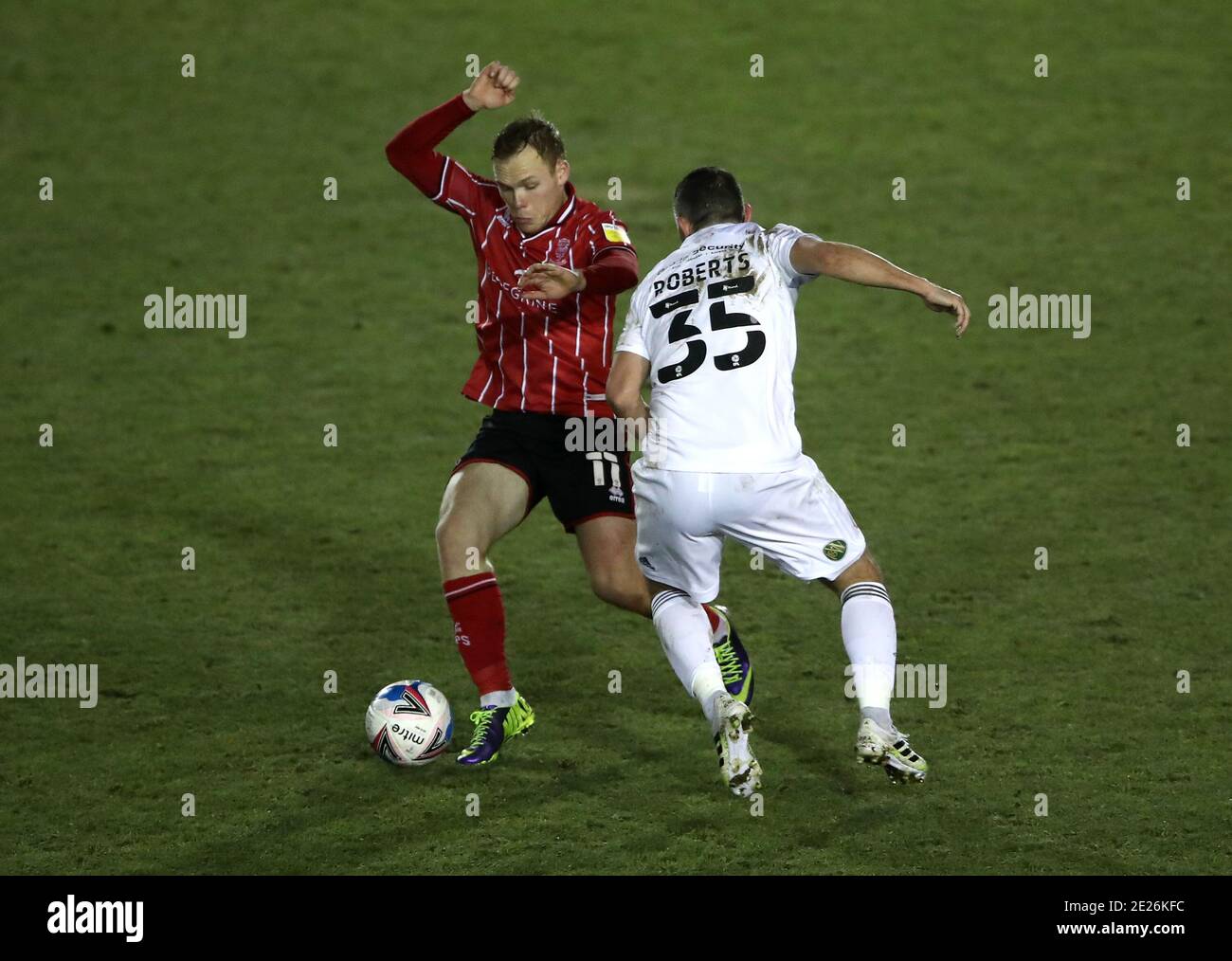 Lincoln City's Anthony Scully (left) and Accrington Stanley's Gary ...