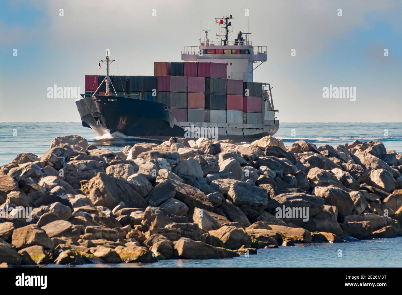 container vessel ship entering the pass between St. Andrews State Park ...