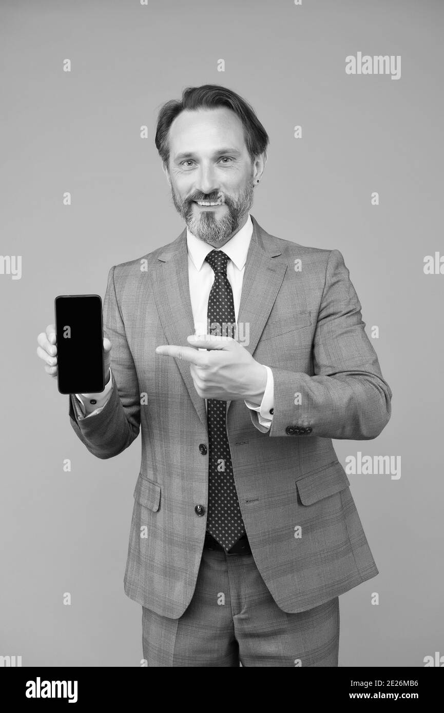 Man formal clothes manager showing mobile screen, app trial concept ...