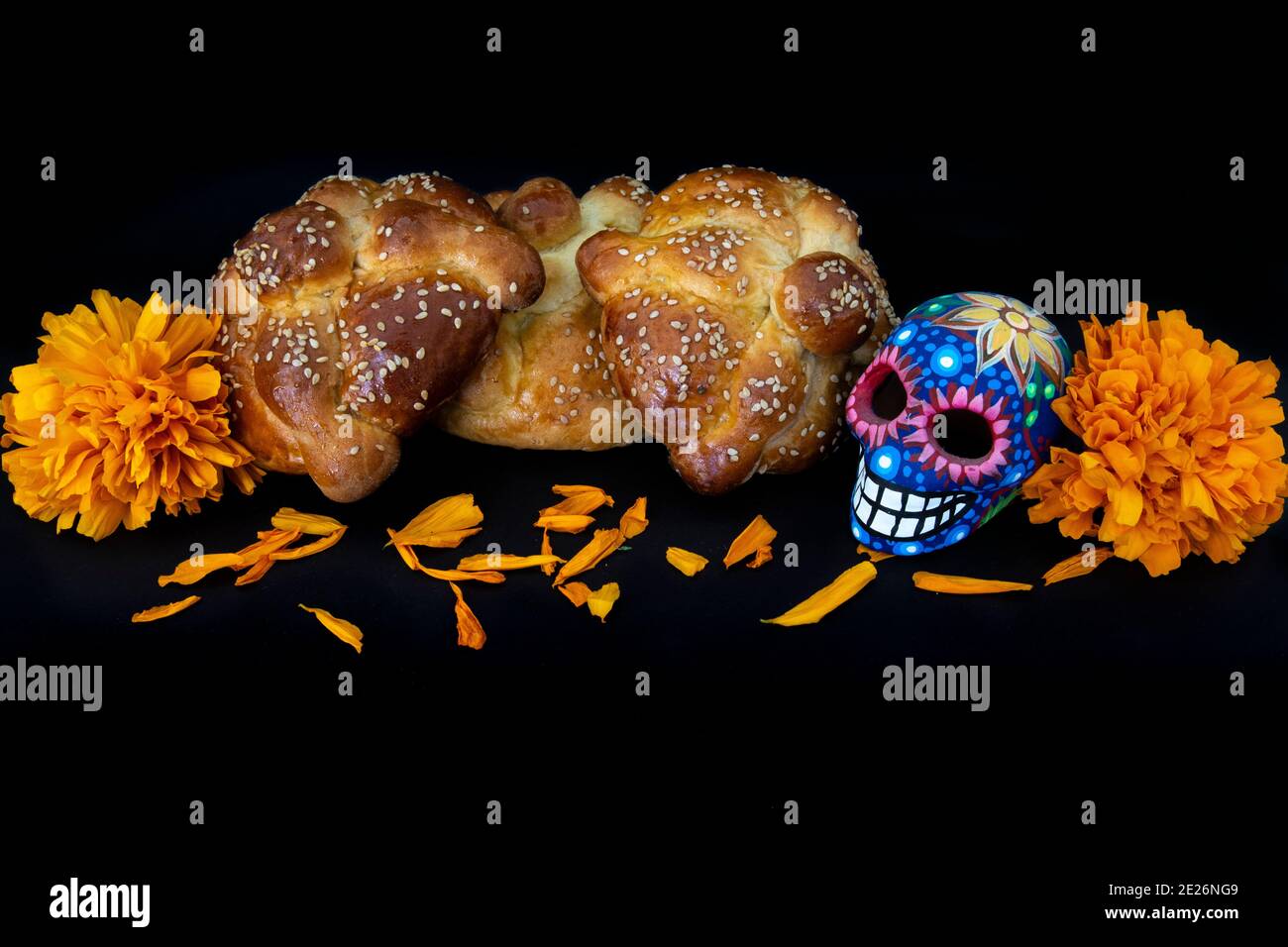 Small ofrenda with pan de muerto, cempasuchil flowers and skull Stock ...