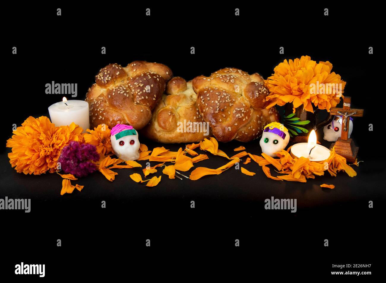 Traditional ofrenda with pan de muerto, cempasuchil flowers and skulls ...