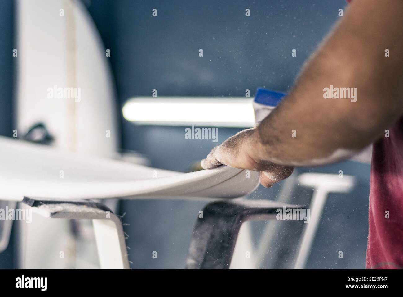 Shaper in the surfboard sanding room Stock Photo - Alamy