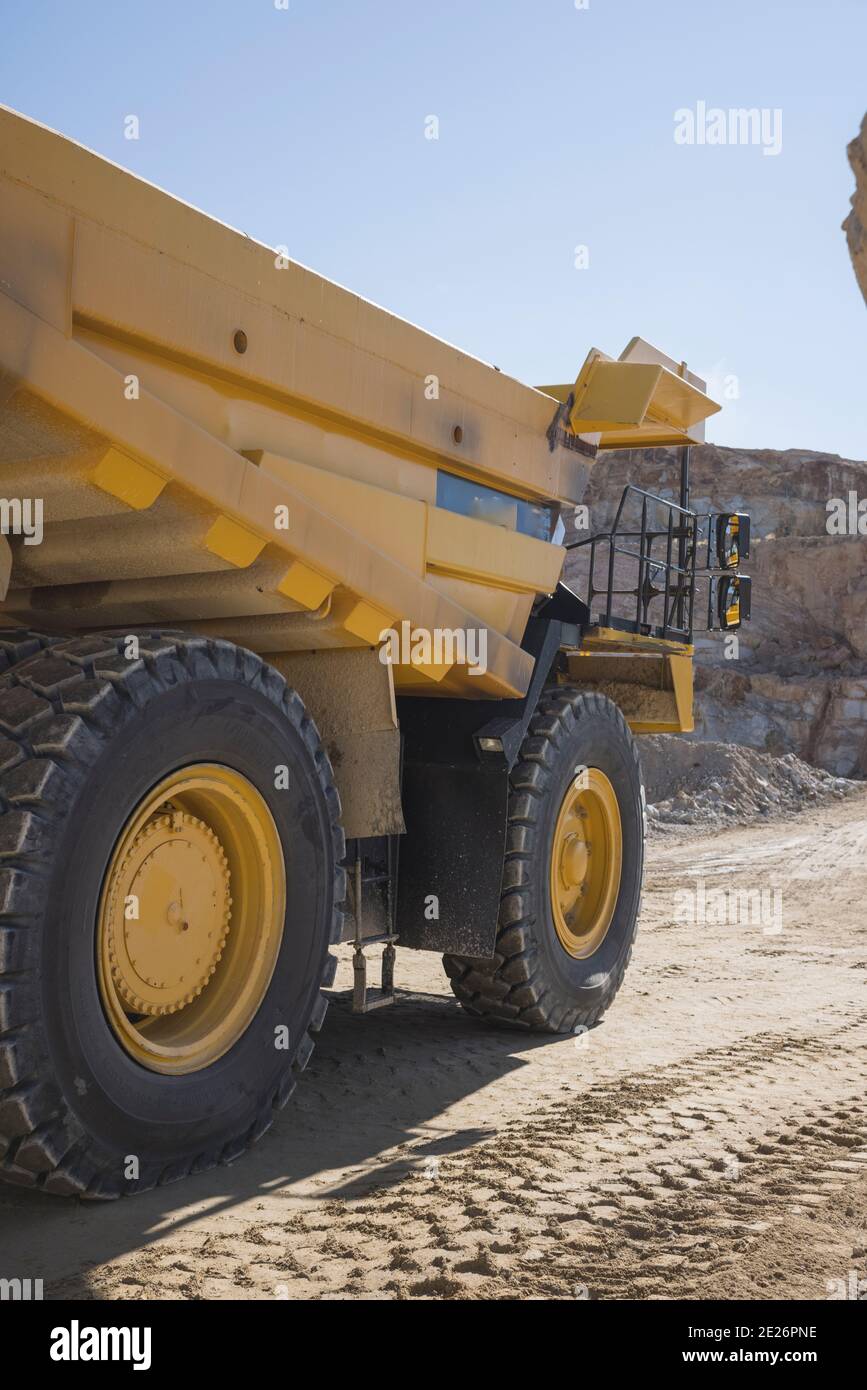 Brand new mining tractor working in open pit mining Stock Photo - Alamy