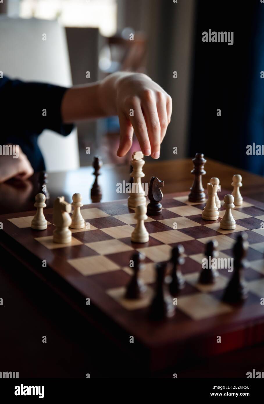 Hand moving chess pieces hi-res stock photography and images - Alamy