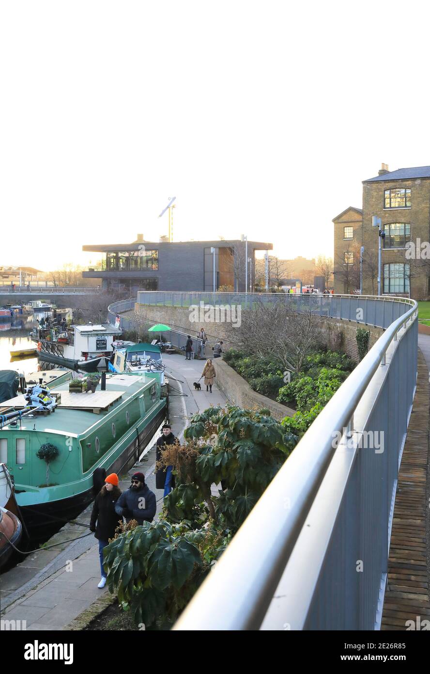 Walking along the towpath of the Regents Canal at Kings Cross, on a ...