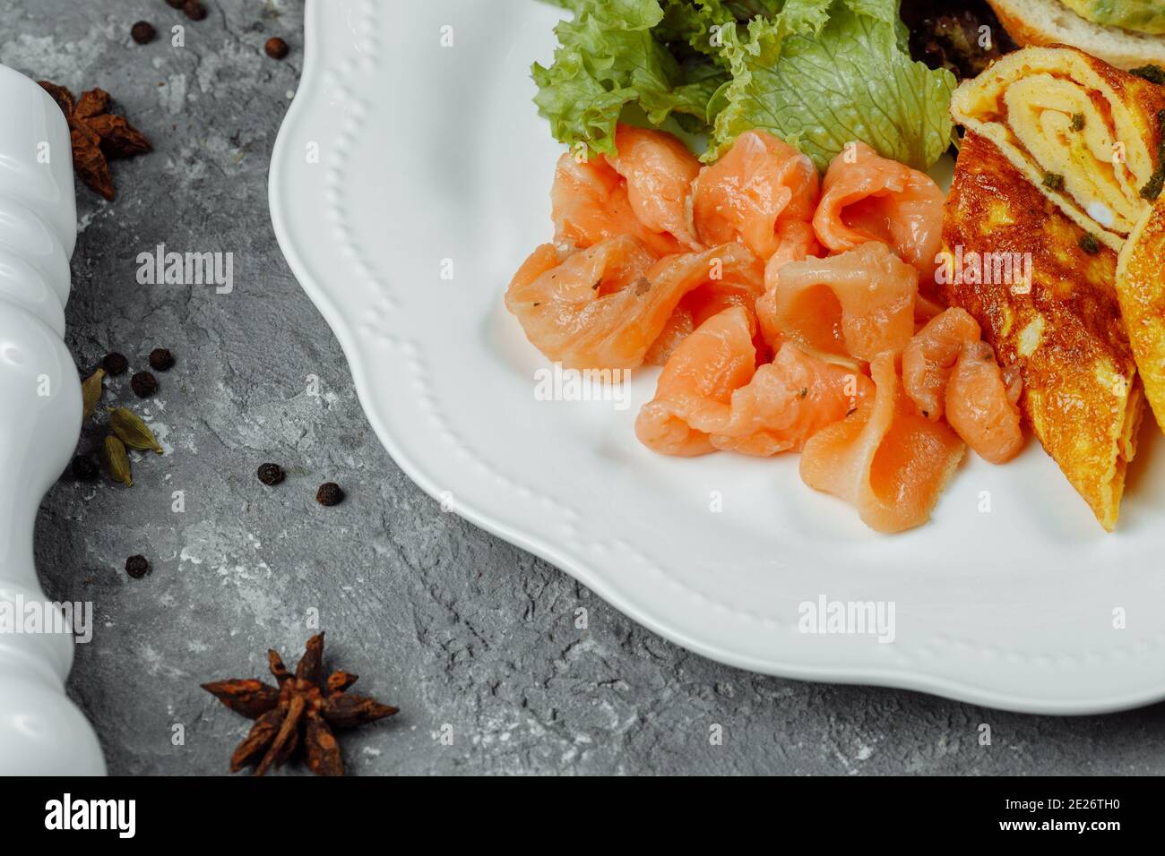 omelet with red fish and vegetables, beautiful serving Stock Photo - Alamy