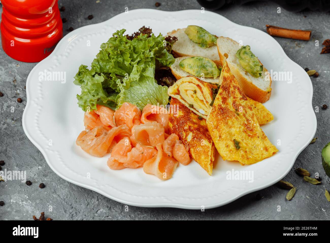 omelet with red fish and vegetables, beautiful serving Stock Photo - Alamy