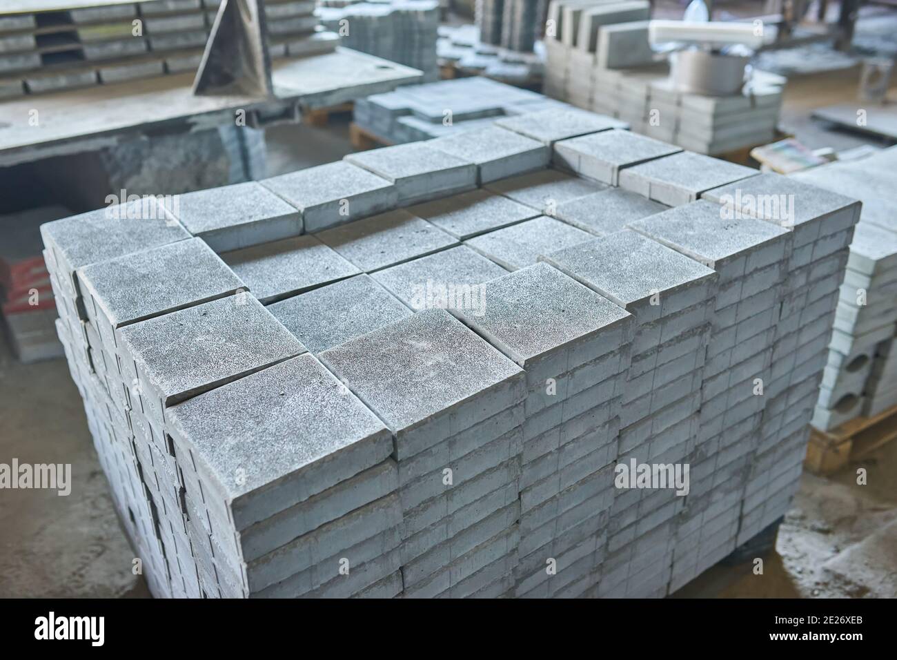 Paving slabs factory. Tiles piled in pallets. Warehouse paving slabs in ...