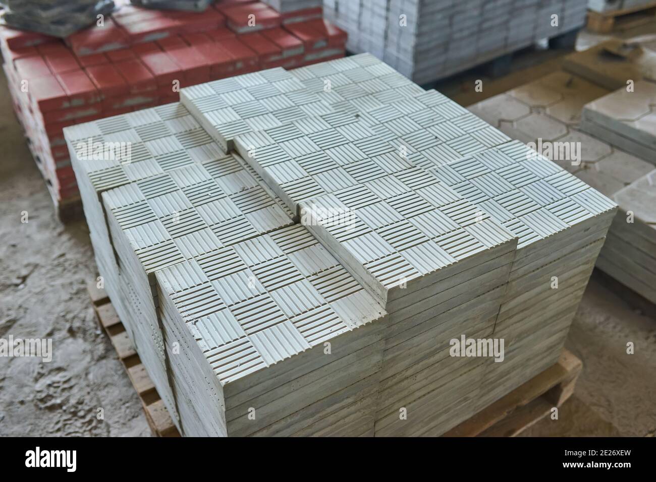 Paving slabs factory. Tiles piled in pallets. Warehouse paving slabs in ...
