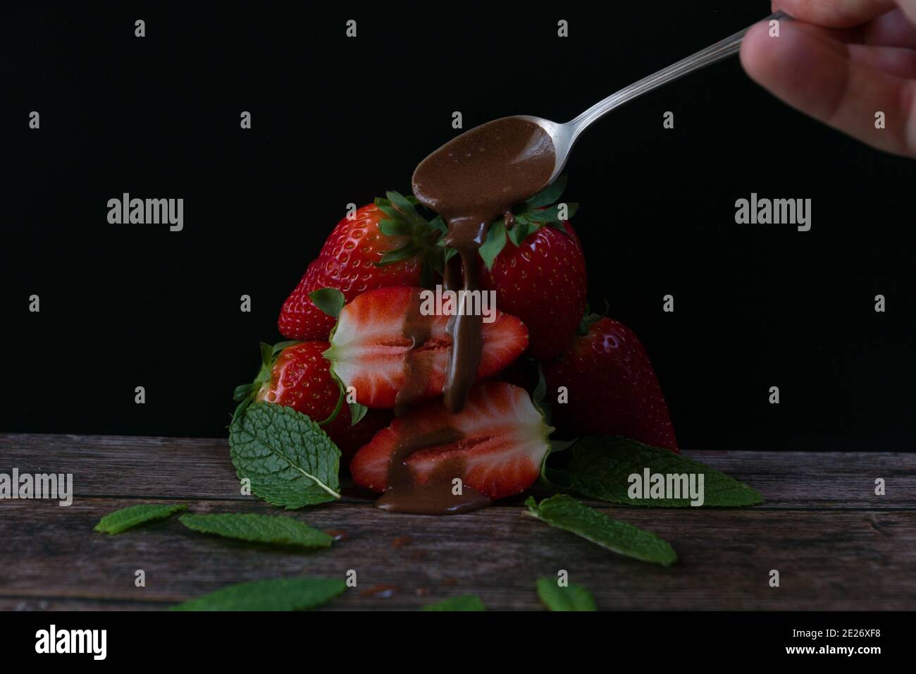 Person spilling chocolate on st Stock Photo - Alamy