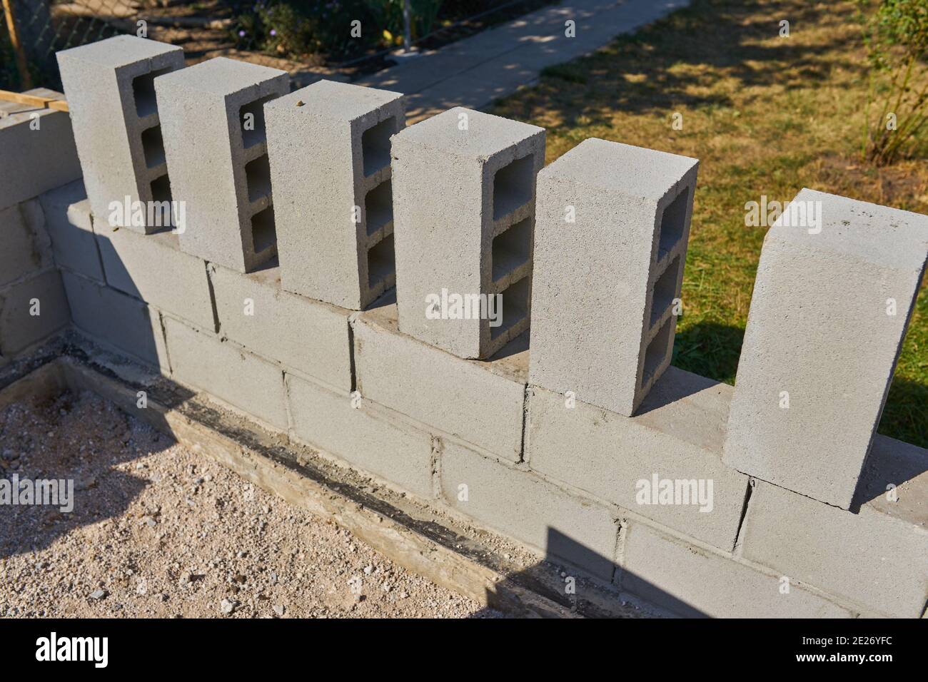 a worker builds a cinder block wall for a new home Stock Photo - Alamy