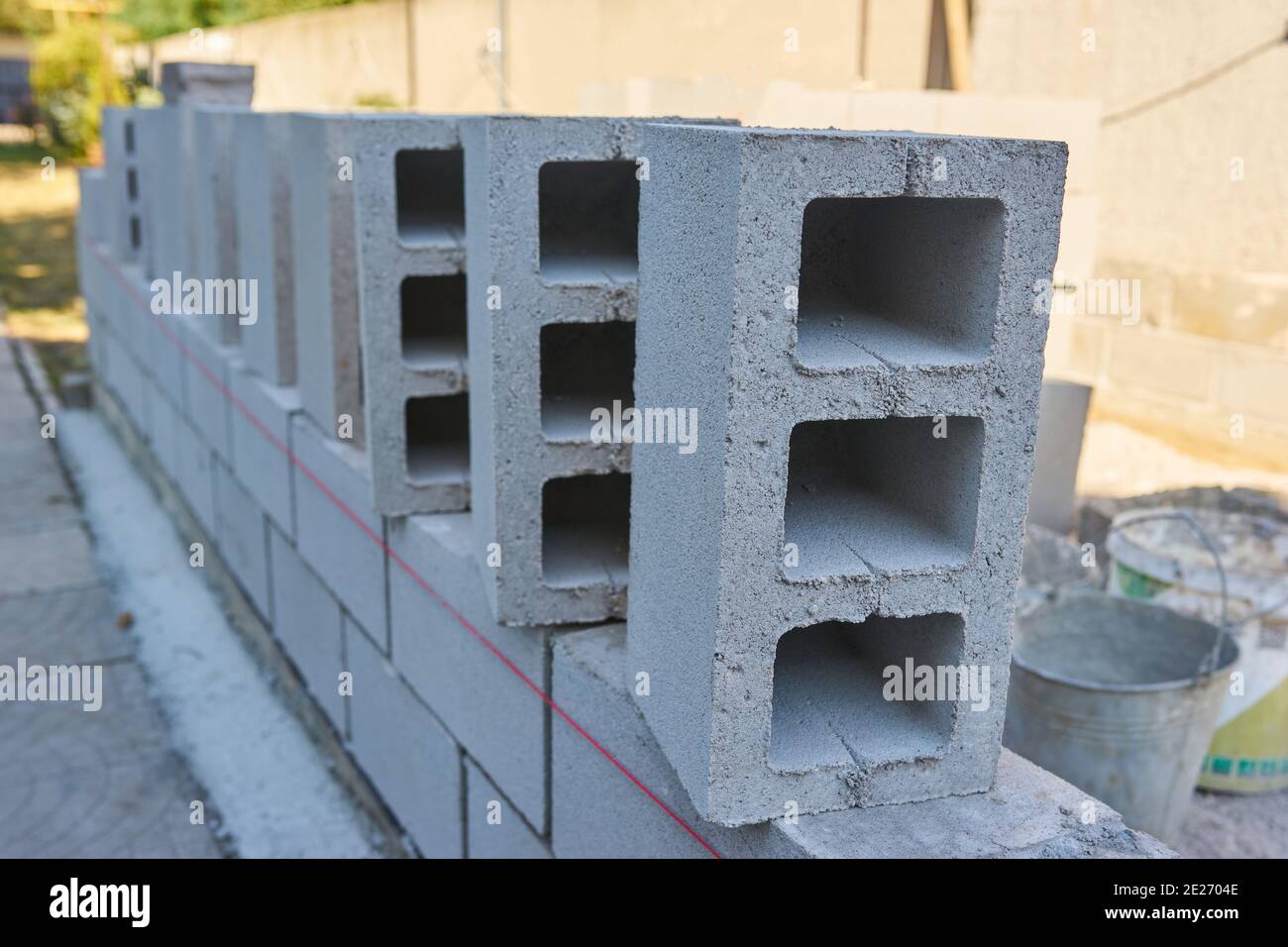 a worker builds a cinder block wall for a new home Stock Photo - Alamy