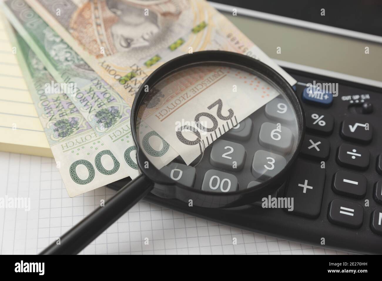 Polish money, calculator and magnifier. Budget and finance concept ...
