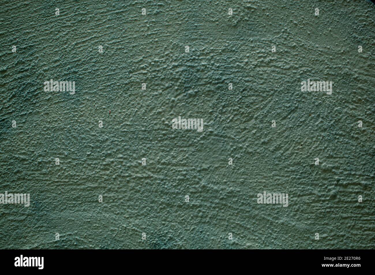 Rough plaster painted dull green wall texture Stock Photo - Alamy