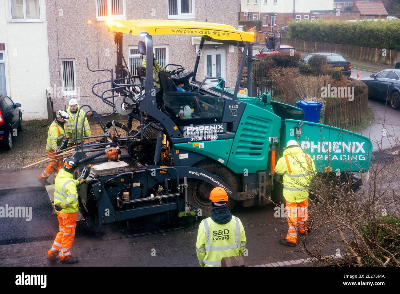 A residential road is resurfaced in the village of Bugbrooke ...