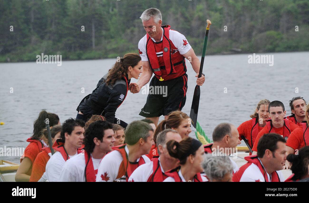 Catherine, Duchess of Cambridge arrives on shore after rowing in a ...
