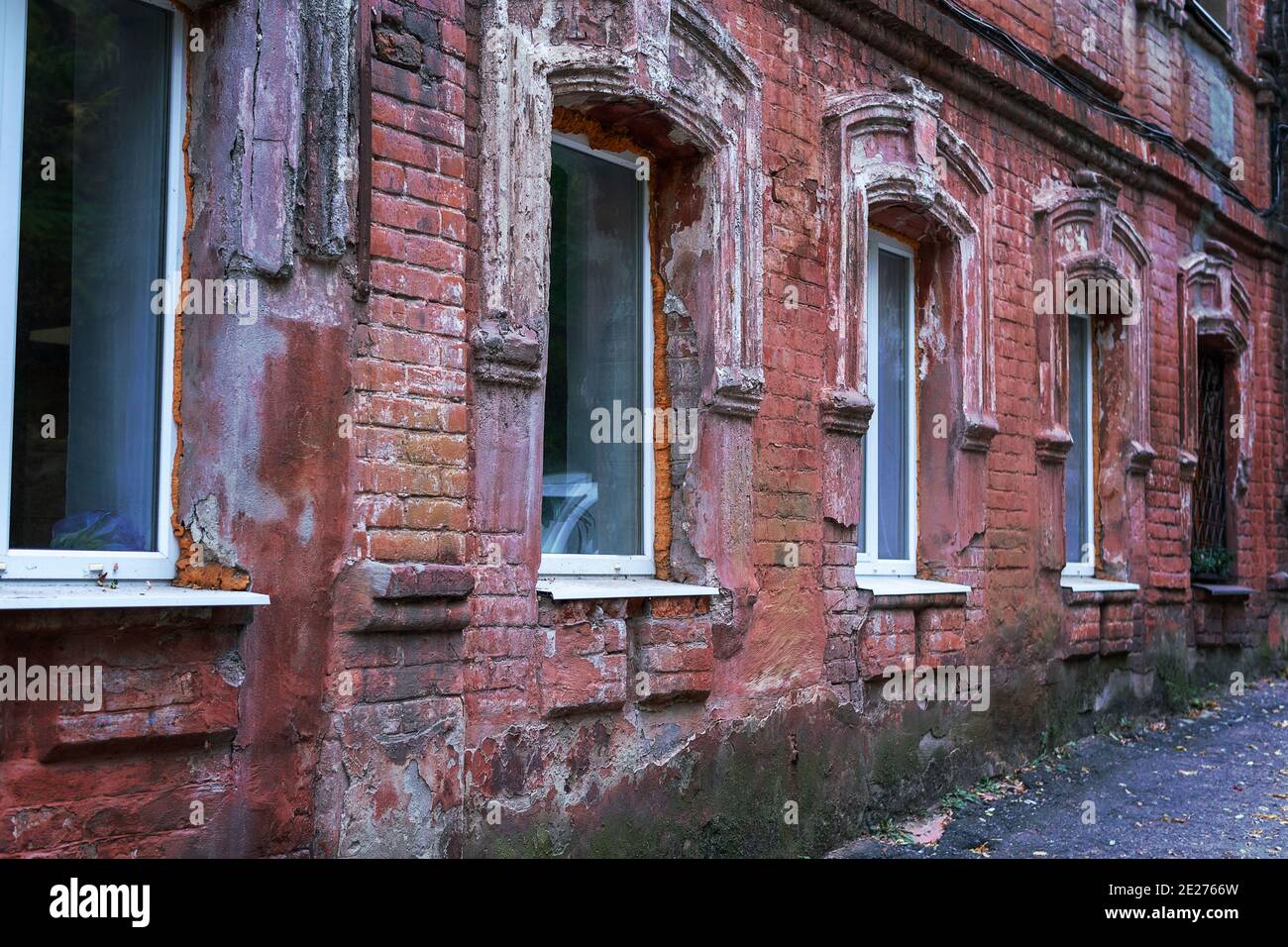 old red brick city building with white windows Stock Photo - Alamy