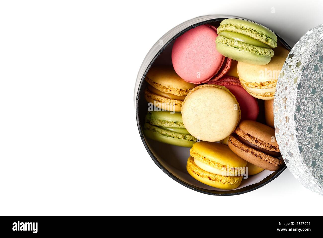 Colorful small macarons in the circle box with lid like a gift with ...