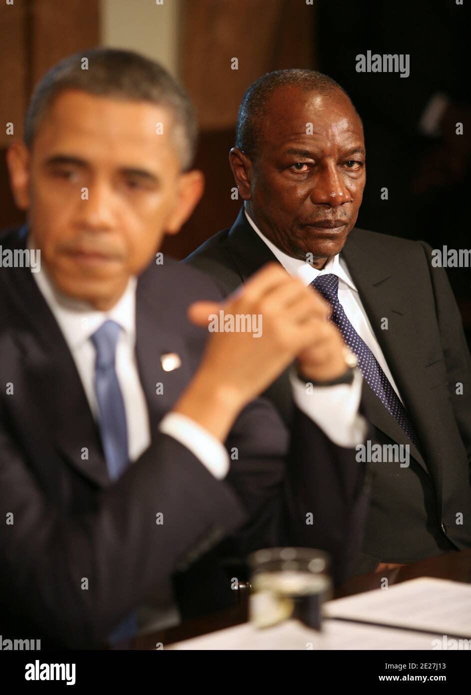 President Alpha Conde of Guinea listens as U.S. President Barack Obama ...