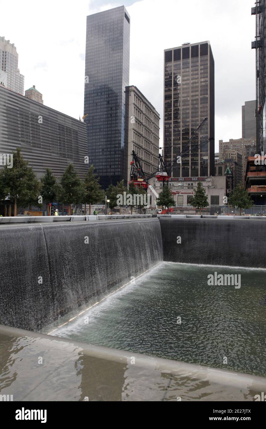 The 9/11 Memorial Pools are tested with water by construction workers ...